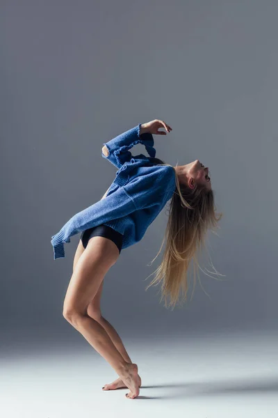 Young beautiful female dancer is posing in the studio ⬇ Stock Photo ...