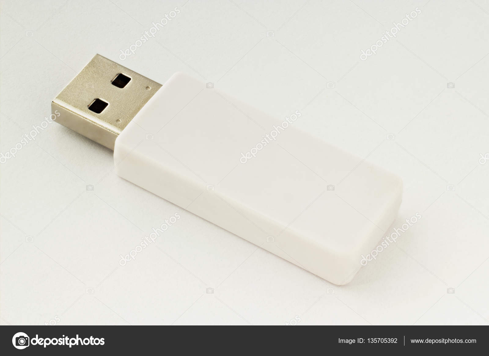 White USB flash drive on a white background. Full focus front and back ...