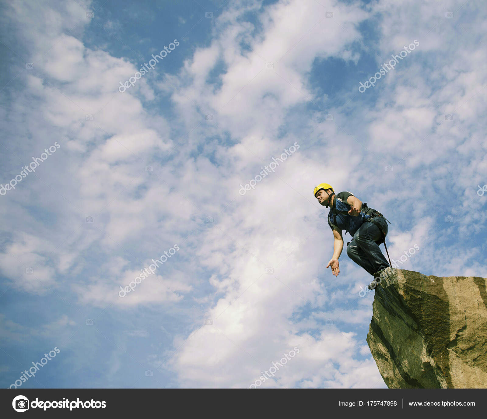 A man is jumping from a cliff to an abyss. — Stock Photo © vetal1983 ...