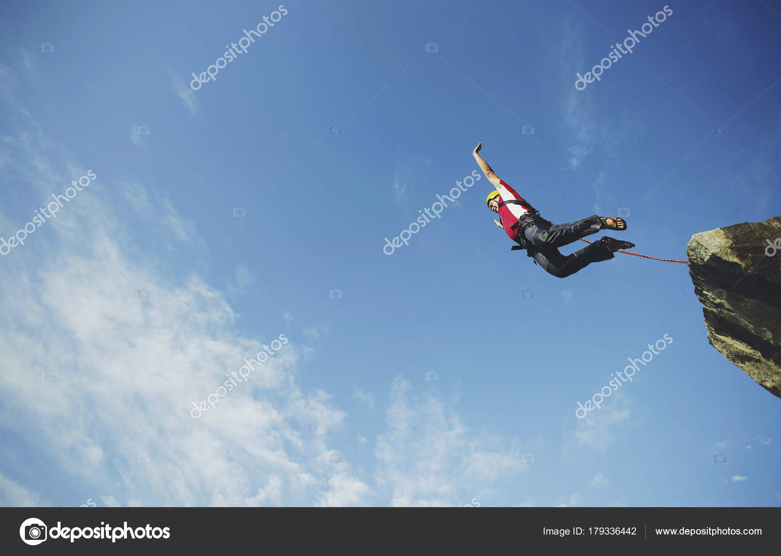 A man jumps into a canyon from a cliff. — Stock Photo © vetal1983 ...