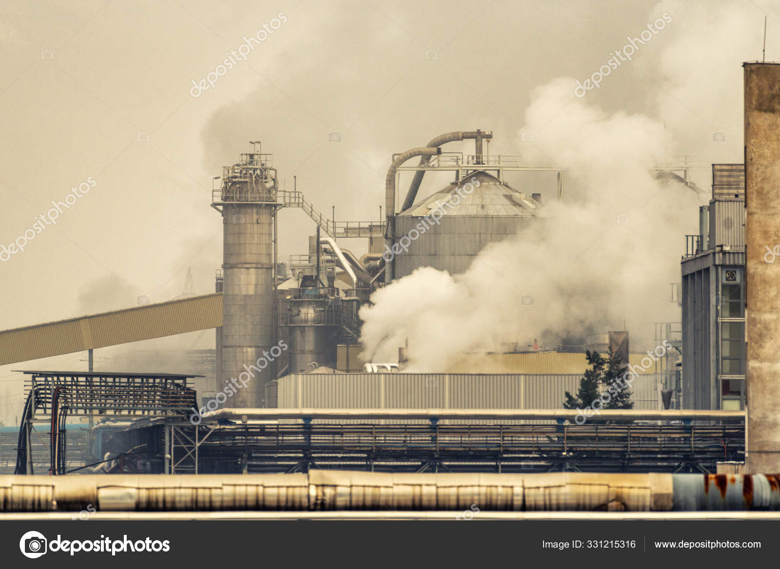 Smoke from chimney in factory Stock Photo by ©jarino 331215316