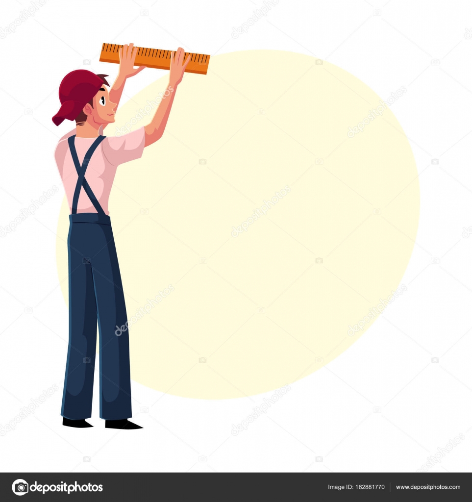 Construction worker, builder in uniform measuring wall with a ruler ...