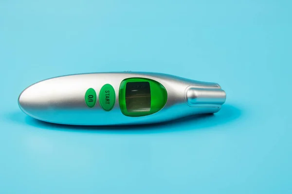 Temperature Measurement Device thermometer isolated on blue background ...