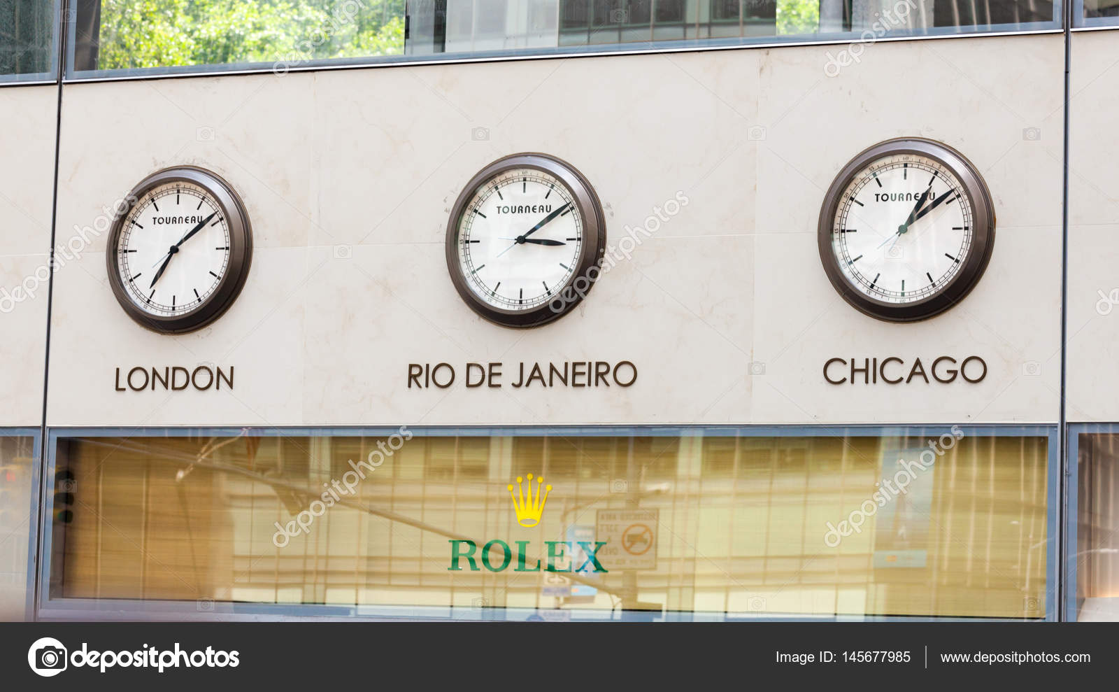 Rolex Showcase with clocks on the wall with time zones. — Stock ...