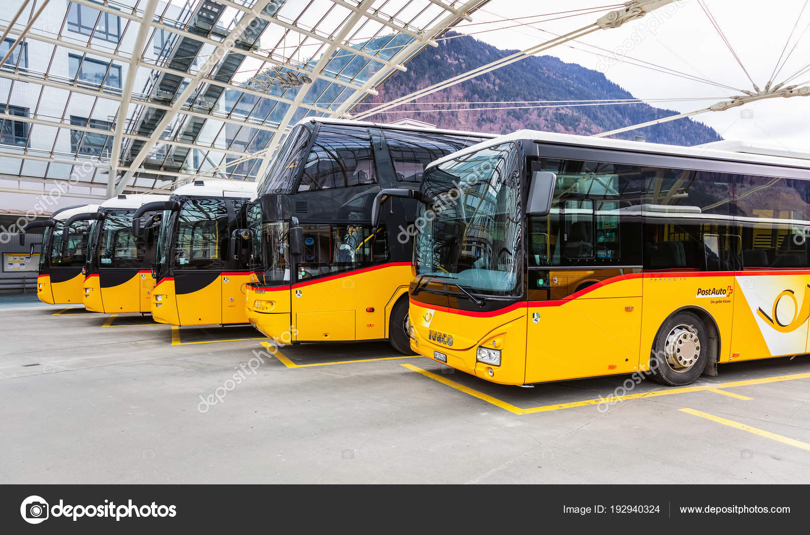 Post Buses at the bus station in the city of Chur in Switzerland ...