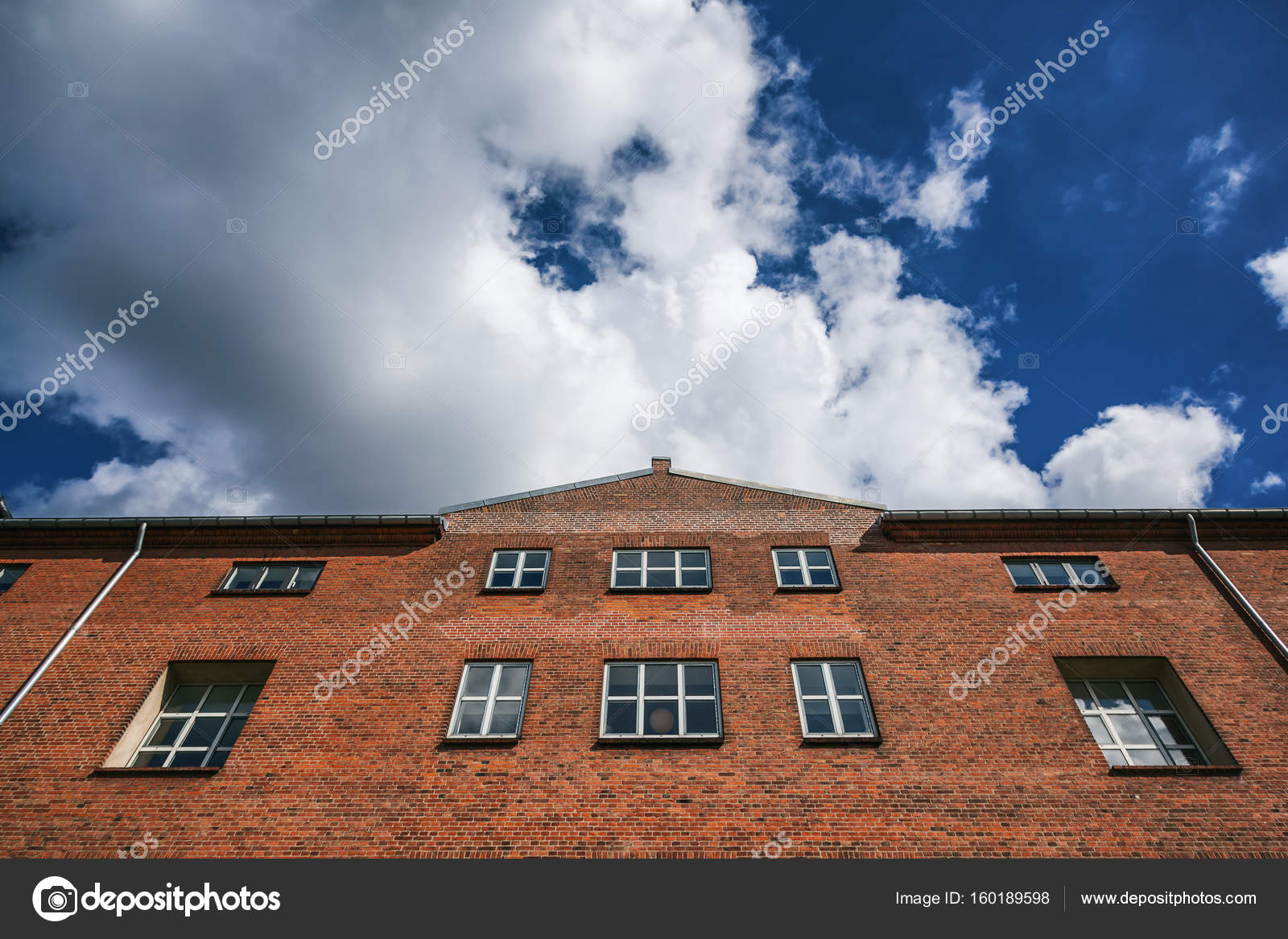 Facade of red brick building against the blue sky, Scandinavian Stock ...