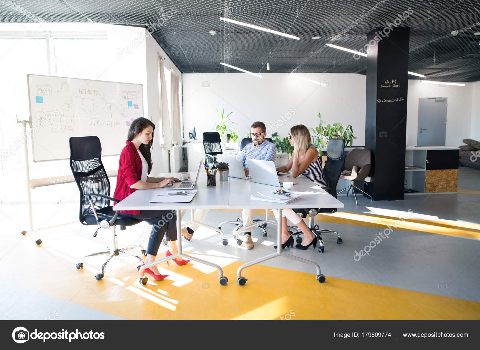Three business people in the office talking together. — Stock Photo ...