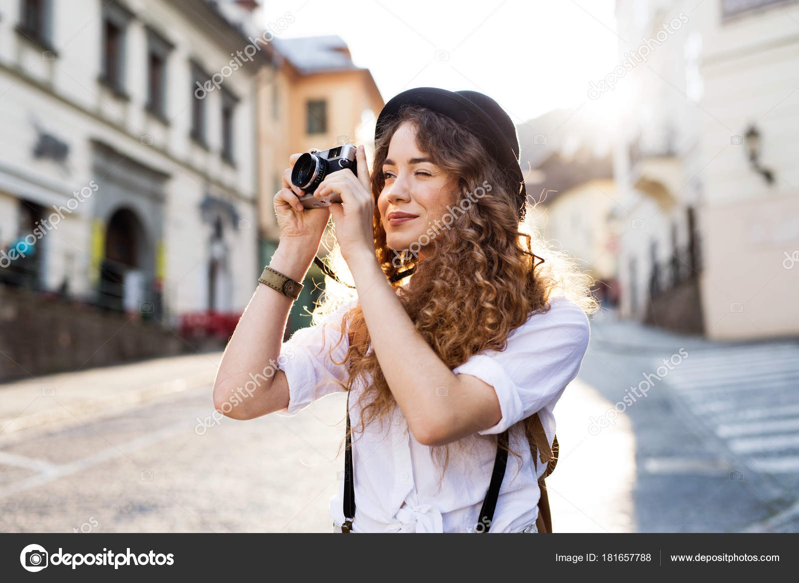 Beautiful young tourist with camera in the old town. — Stock Photo ...