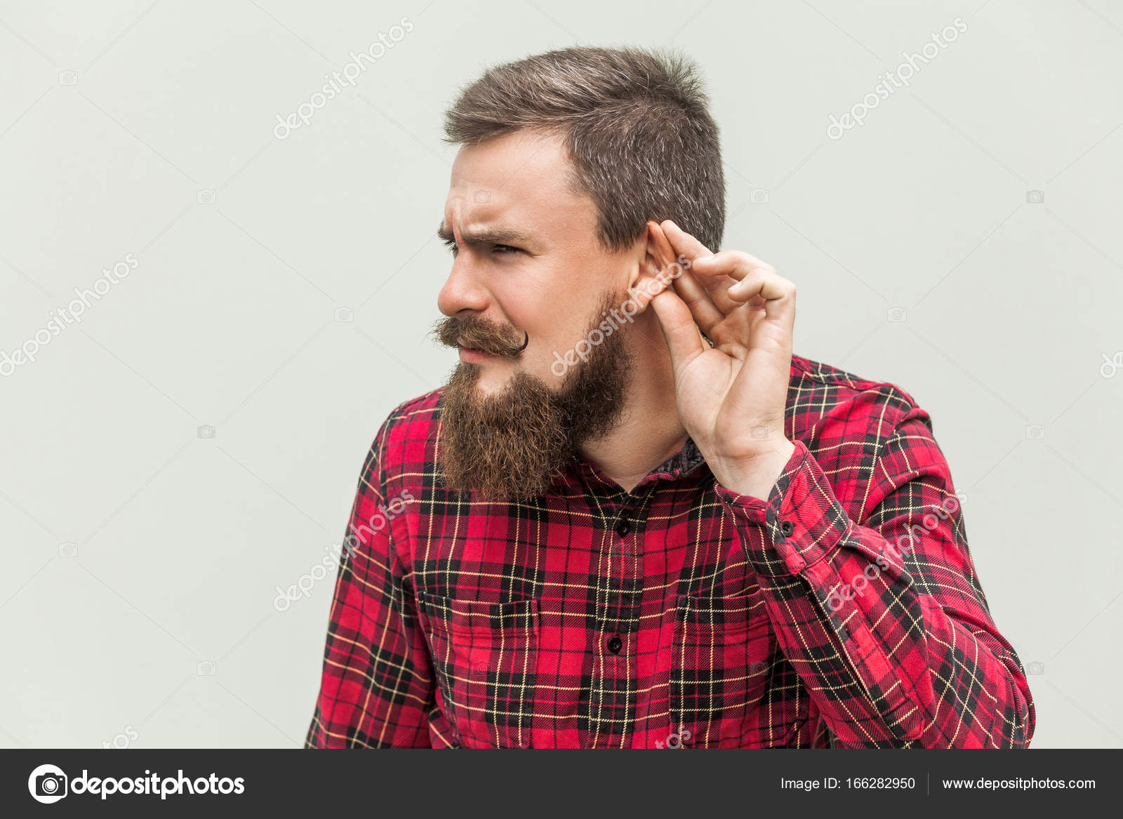 I can not hear you. Young adult bearded man listen Stock Photo by ...