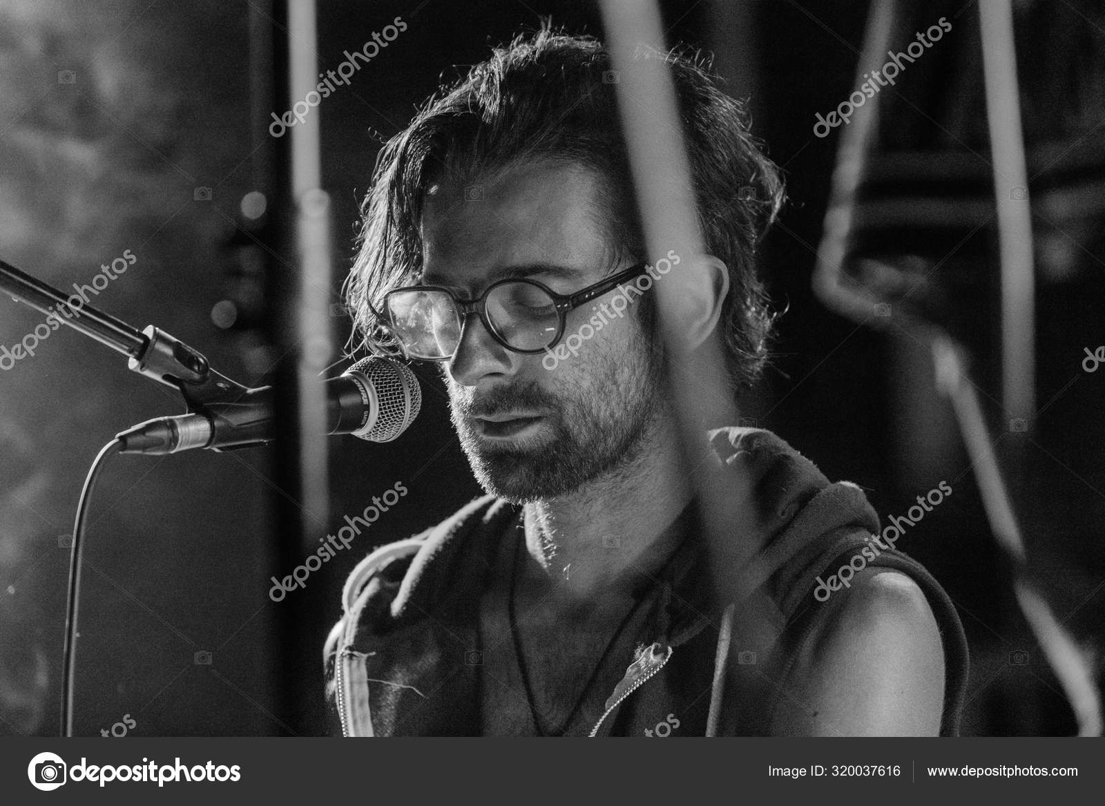 A male singer performing on stage — Stock Photo © Valmedia #320037616