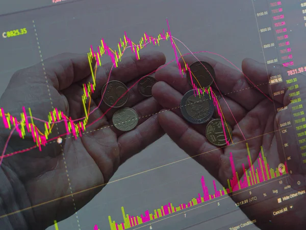 two hands with euro coins. Technical price graph and indicator, red and ...