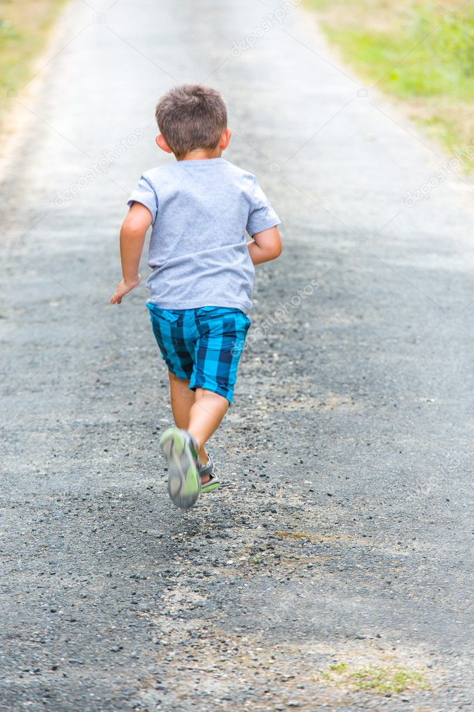 Child running along a country road Stock Photo by ©Pixinooo 125757836