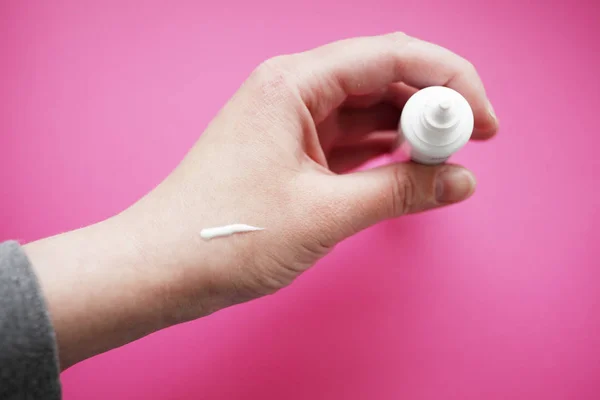 Woman testing cream on hand Stock Photo by ©perminoffa 169518432