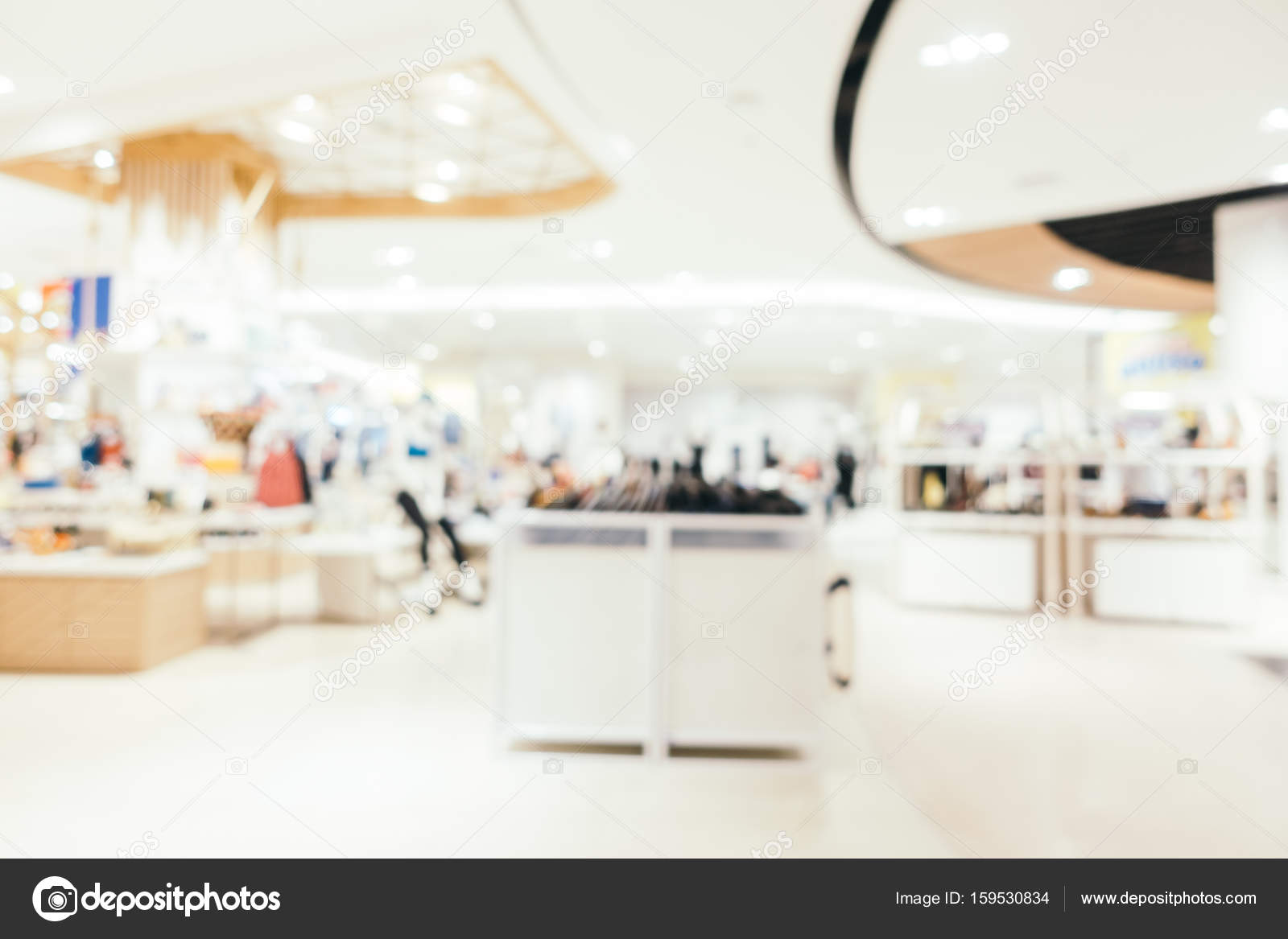 Abstract blur and bokeh defocused shopping mall interior of depa ...