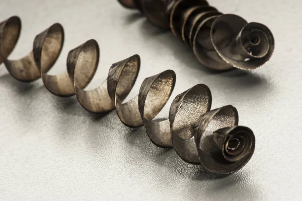 Scrap Metal Shavings. Beautiful decorative metal shavings on a gray ...