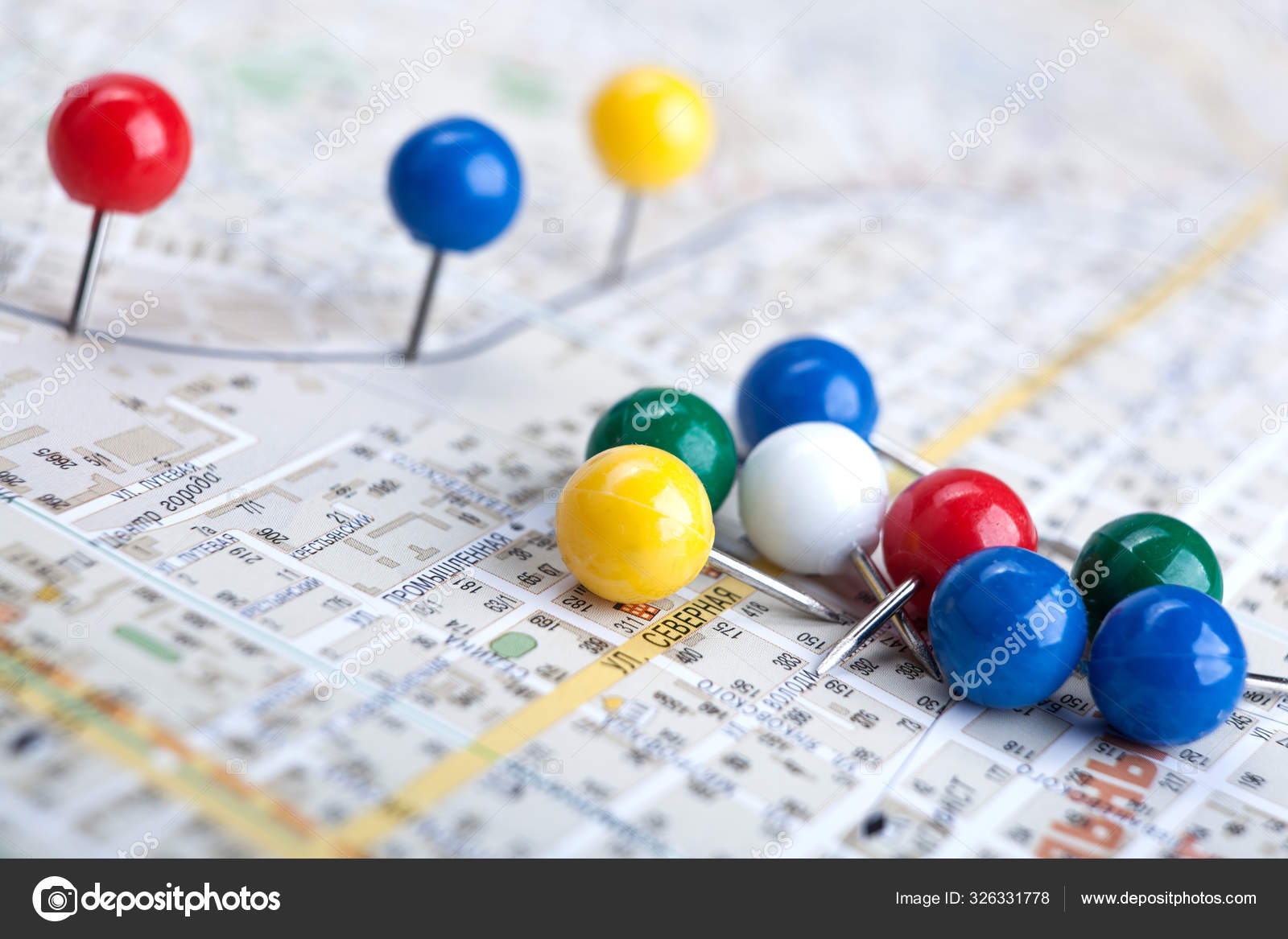 Topographic map with colored needles pushpins close up Stock Photo by ...