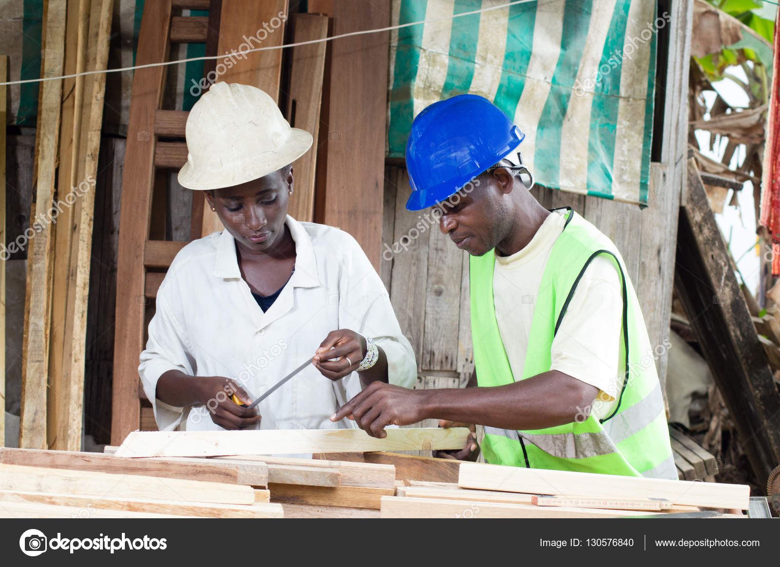 Training of a young student in carpentry. Stock Photo by ©vystek 130576840