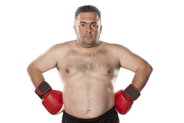 Fat man with boxing gloves — Stock Photo © VGeorgiev #143321099