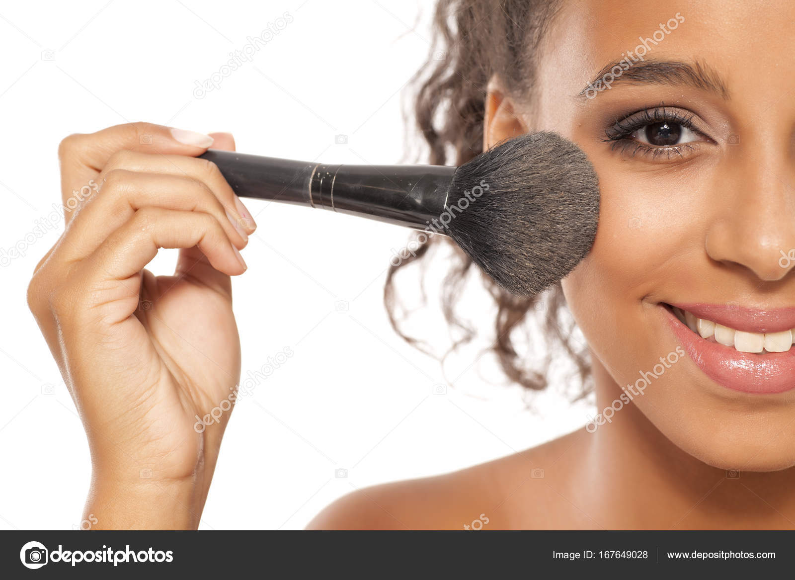 Woman applying a highlighter Stock Photo by ©VGeorgiev 167649028
