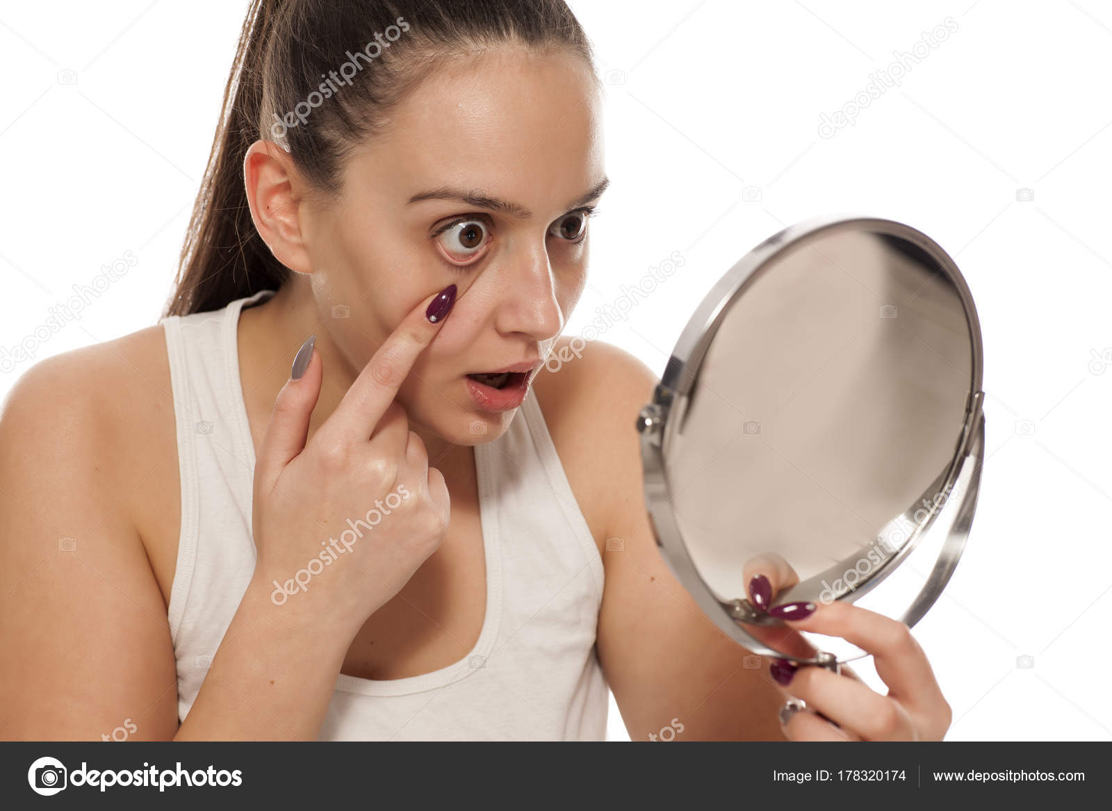 Young Woman Pulling Her Lower Eyelid — Stock Photo © VGeorgiev #178320174