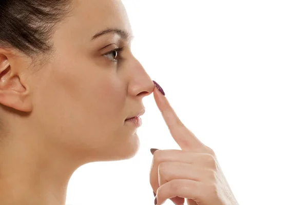 Woman touching nose Stock Photos, Royalty Free Woman touching nose ...