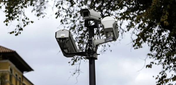 Security CCTV Cameras on a lamp post in the park - Stock Image - Everypixel