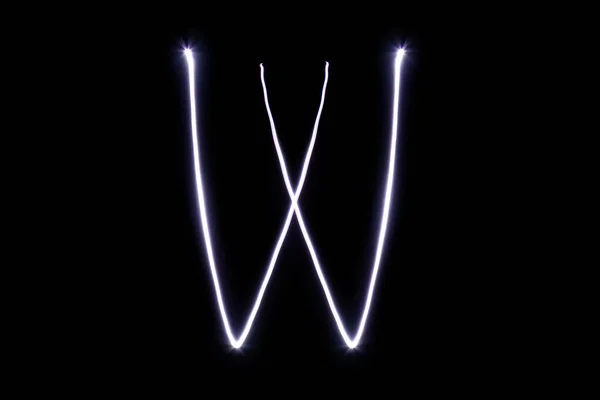 Alphabet made of neon light on a black background. Isolated top view ...