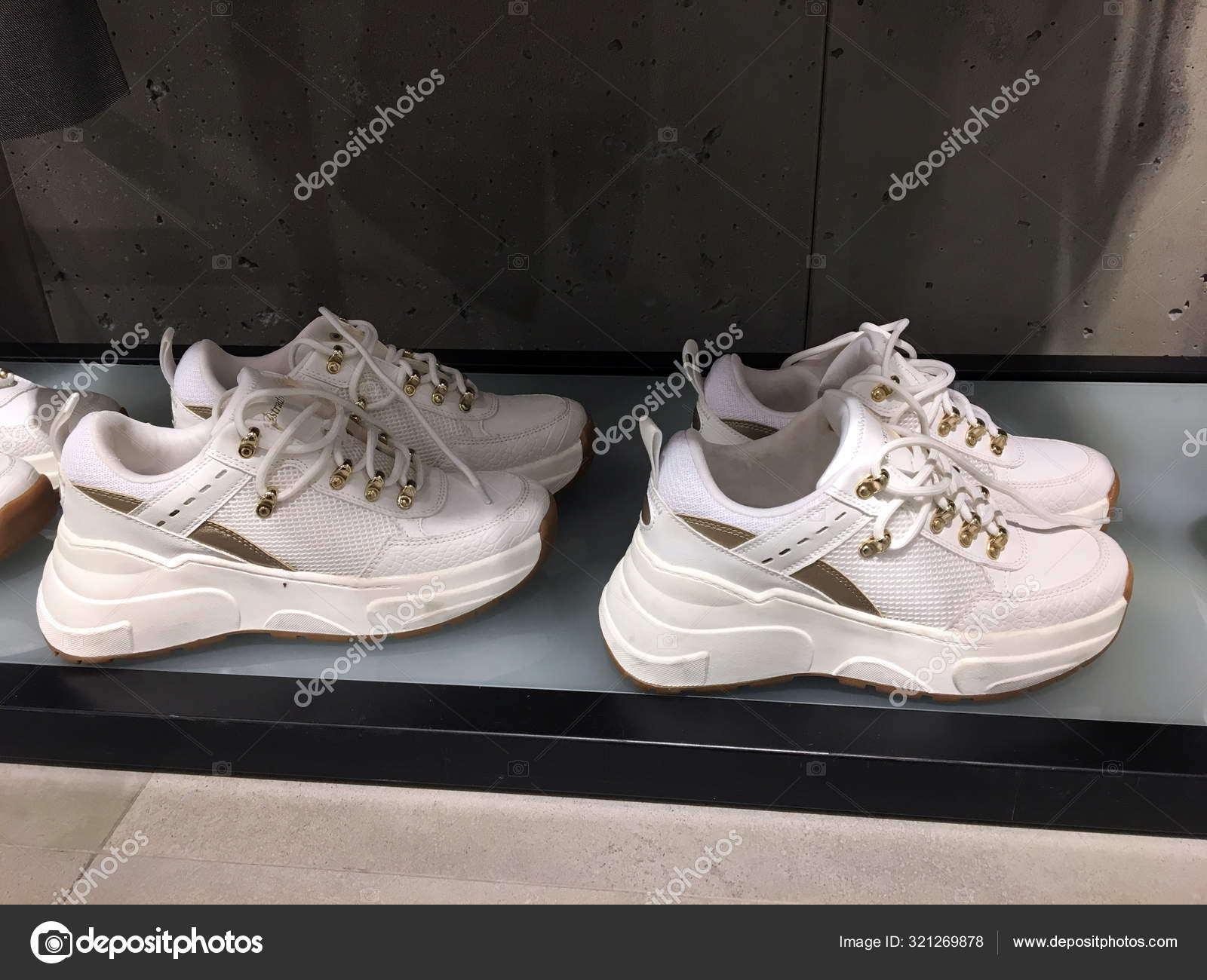 White Maxi Sole Trainers Gold Details Shelf Shoes Store Mass — Stock ...