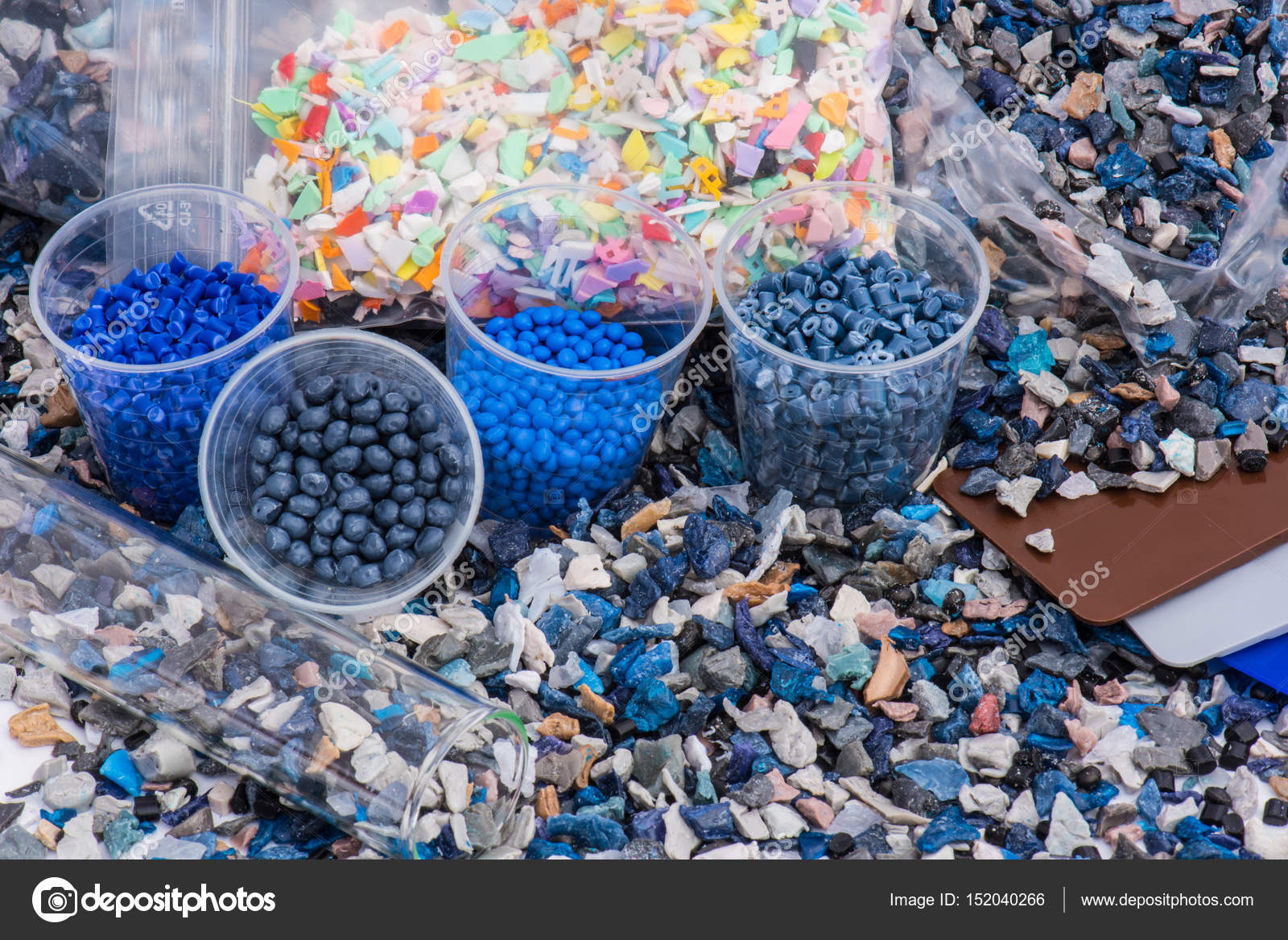 Plastic regrind with samples — Stock Photo © XXLPhoto #152040266