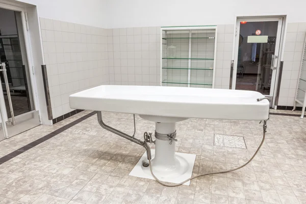 Autopsy tables in morgue Stock Photo by ©DenBoma 126195958