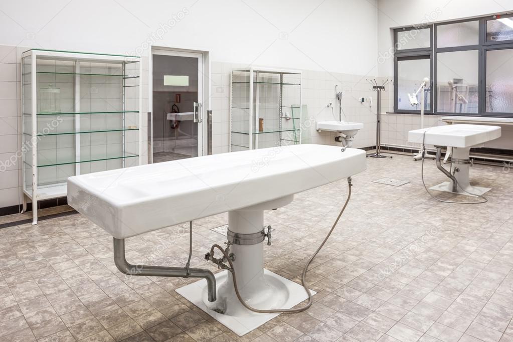 Autopsy tables in morgue Stock Photo by ©DenBoma 126195958