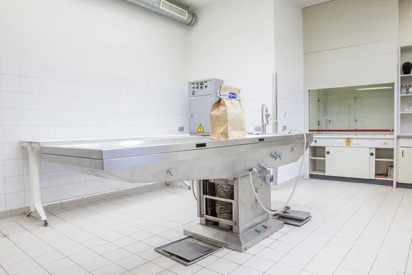 Autopsy tables in morgue — Stock Photo © DenBoma #184678926