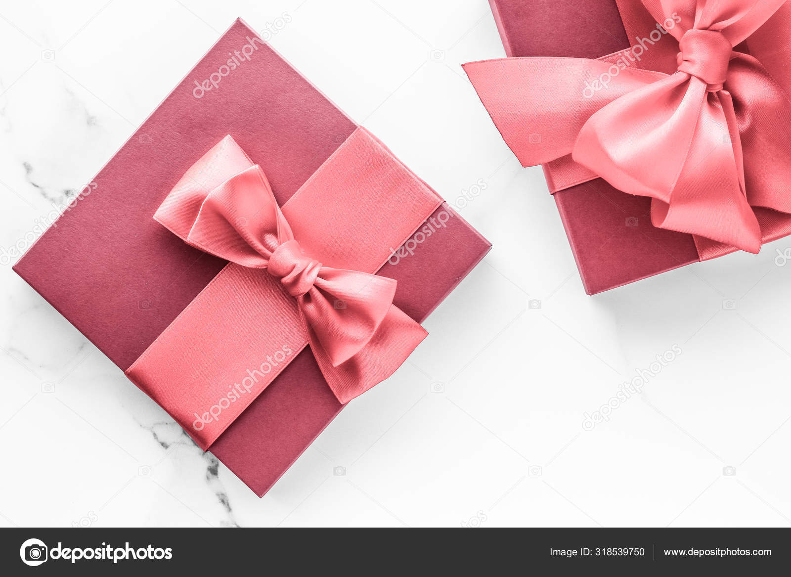 Coral gift box with silk bow on marble background, girl baby sho ...