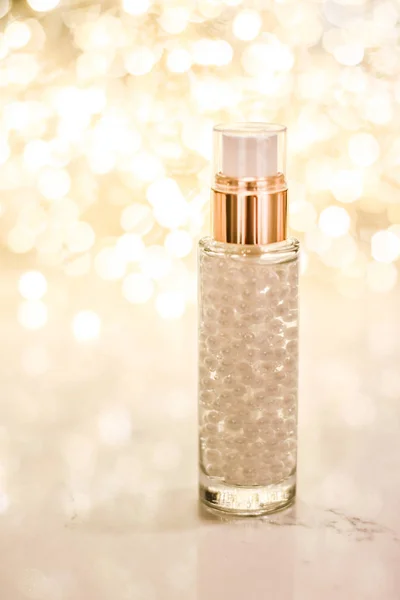 Holiday make-up base gel, serum emulsion, lotion bottle and gold ...