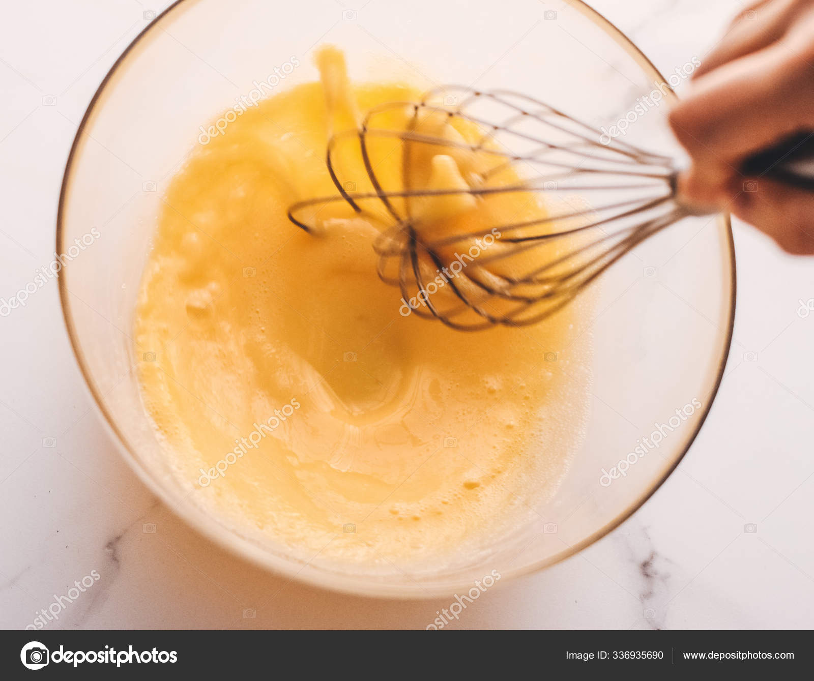 Making of mixing eggs in bowl on marble table as homemade food f ⬇ ...