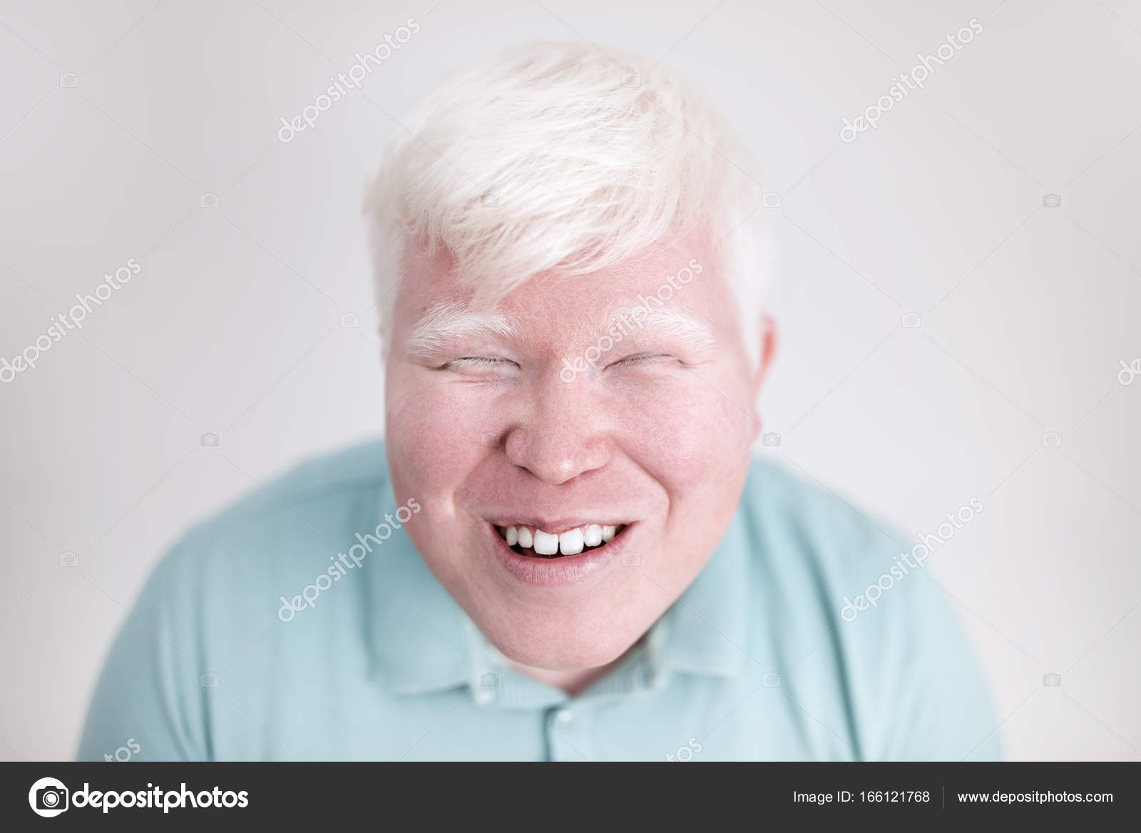 Albino young man portrait. Smiling man isolated at white background ...