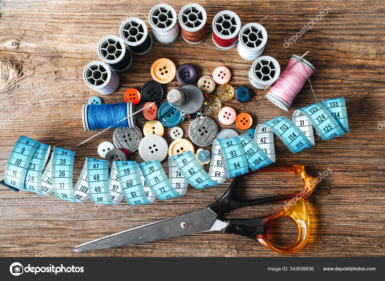 Group of objects about Sewing equipment set on a wooden background ...