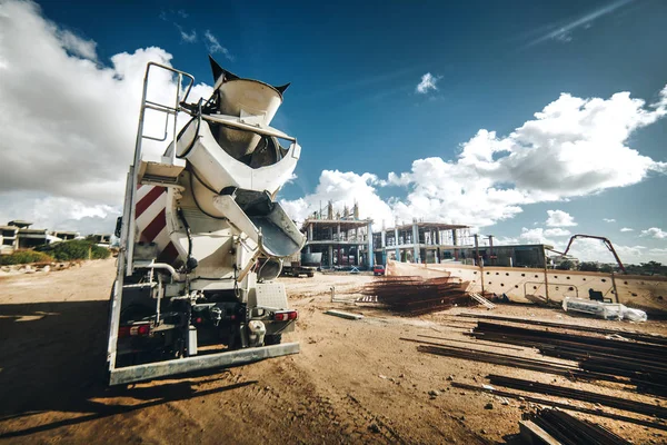 a car with concrete stands on the background of a construction site ...