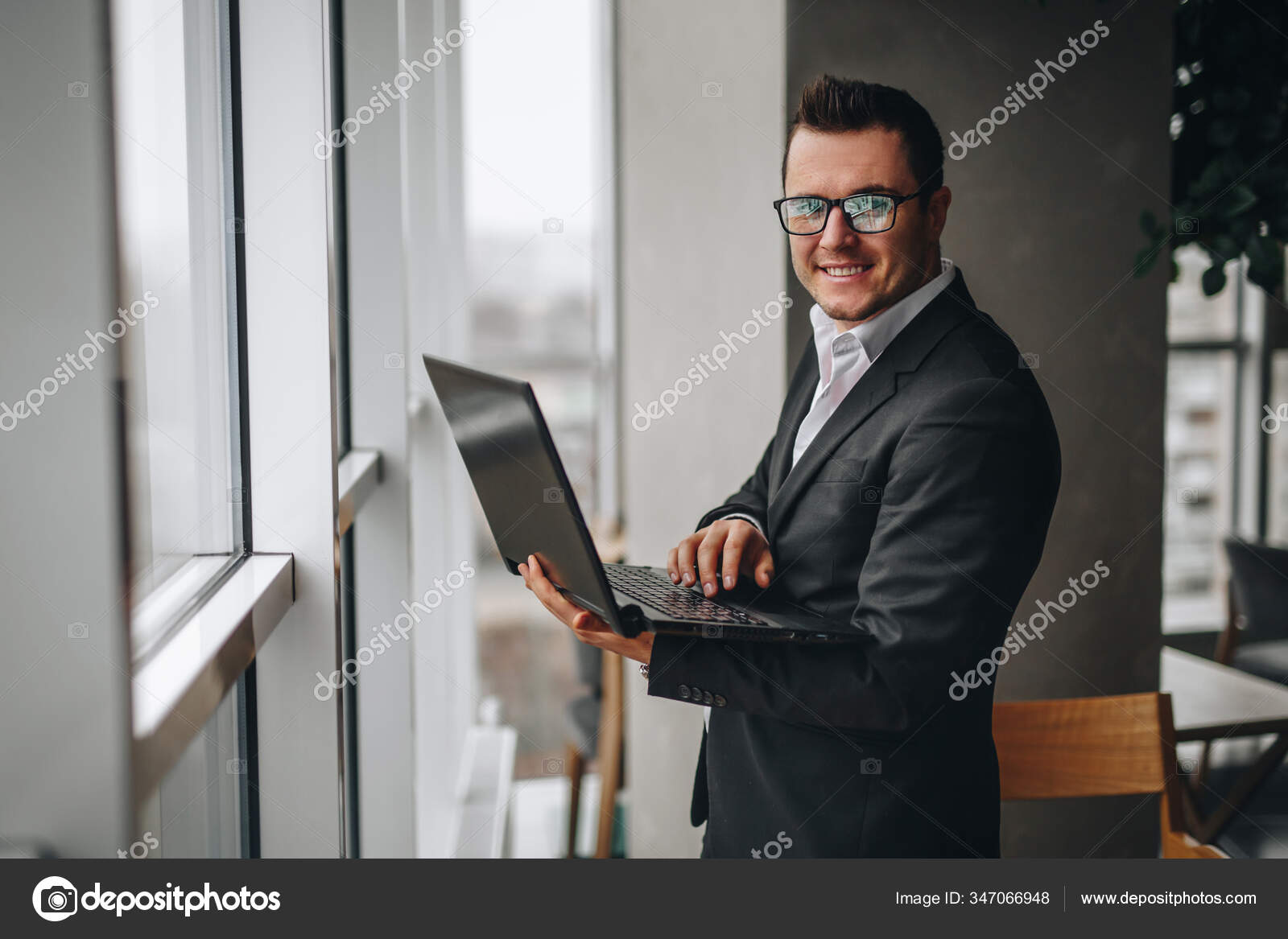 Rich Guy Holds Laptop His Hands Works Standing Window — Stock Photo ...