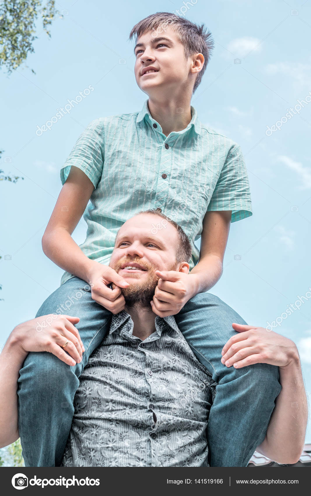 Boy sitting on dad shoulders — Stock Photo © Andy_Di #141519166