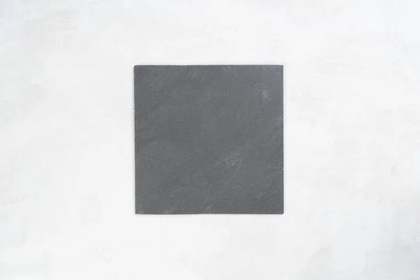 Gray slate board light over cement texture background with copy space ...