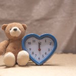 Brown Cute Teddy Bear Hold Alarm Clock Stock Photo by ©tang90246 201556270