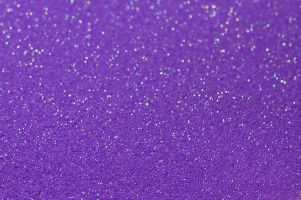 Abstract violet glitter background with shining light and soft bokeh ...