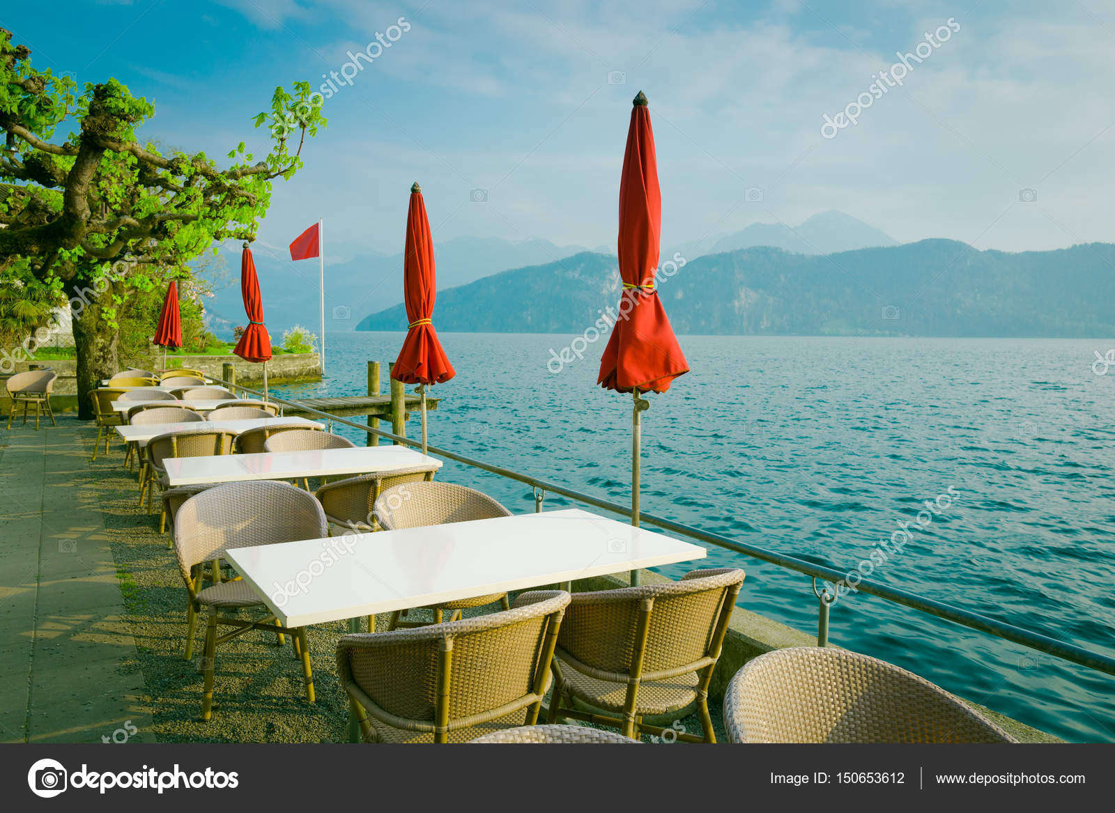 Restaurant over lake and mountains Stock Photo by ©maglara 150653612
