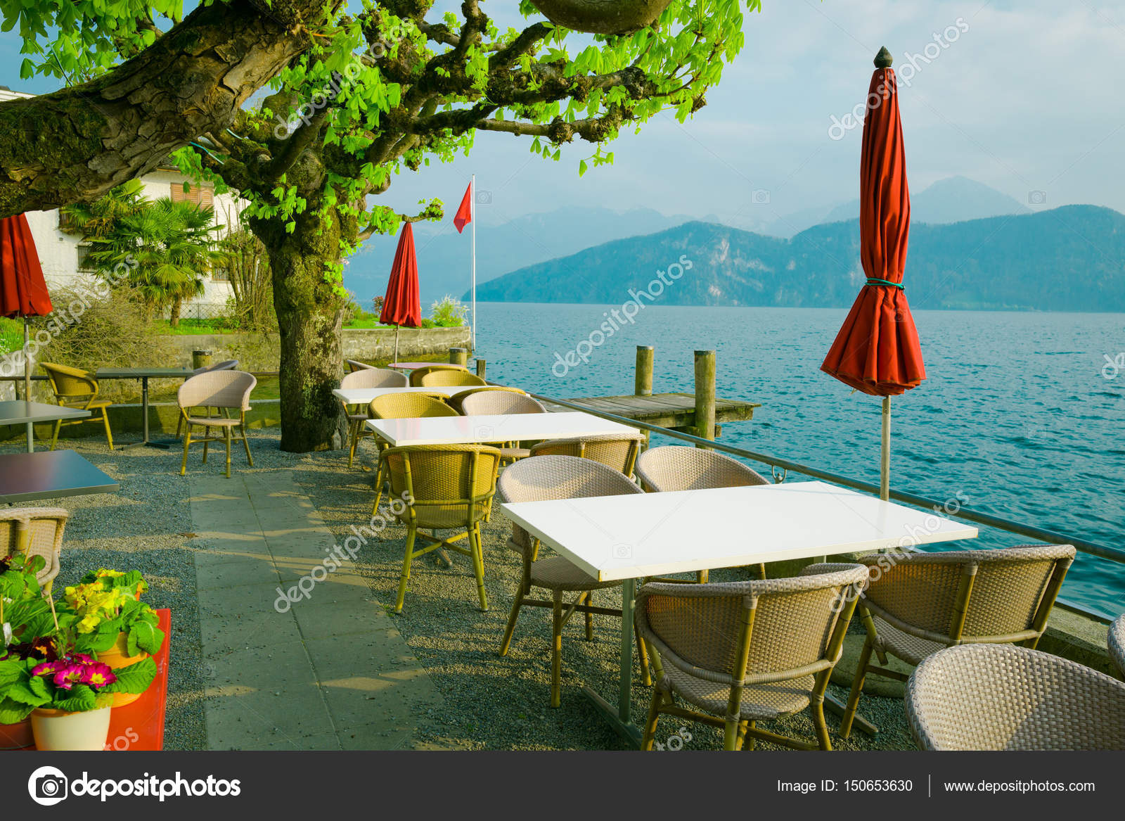 Restaurant over lake and mountains Stock Photo by ©maglara 150653630