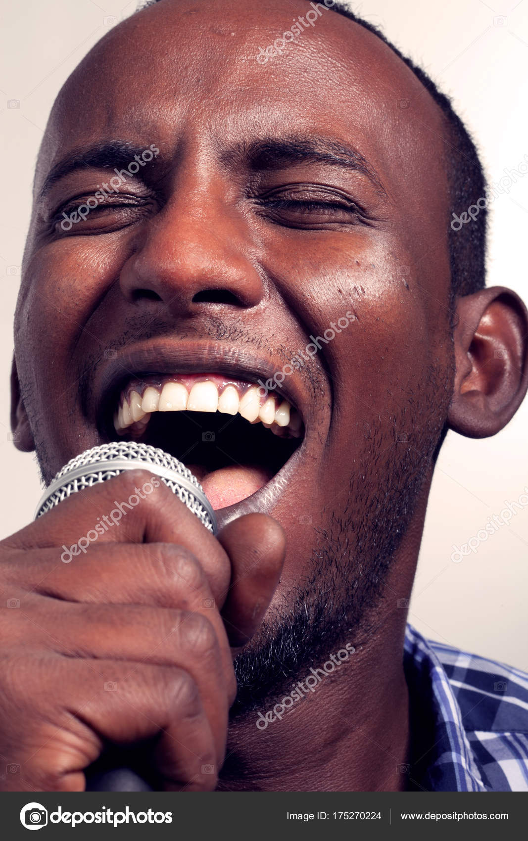 African singer with microphone Stock Photo by ©Zveiger 175270224