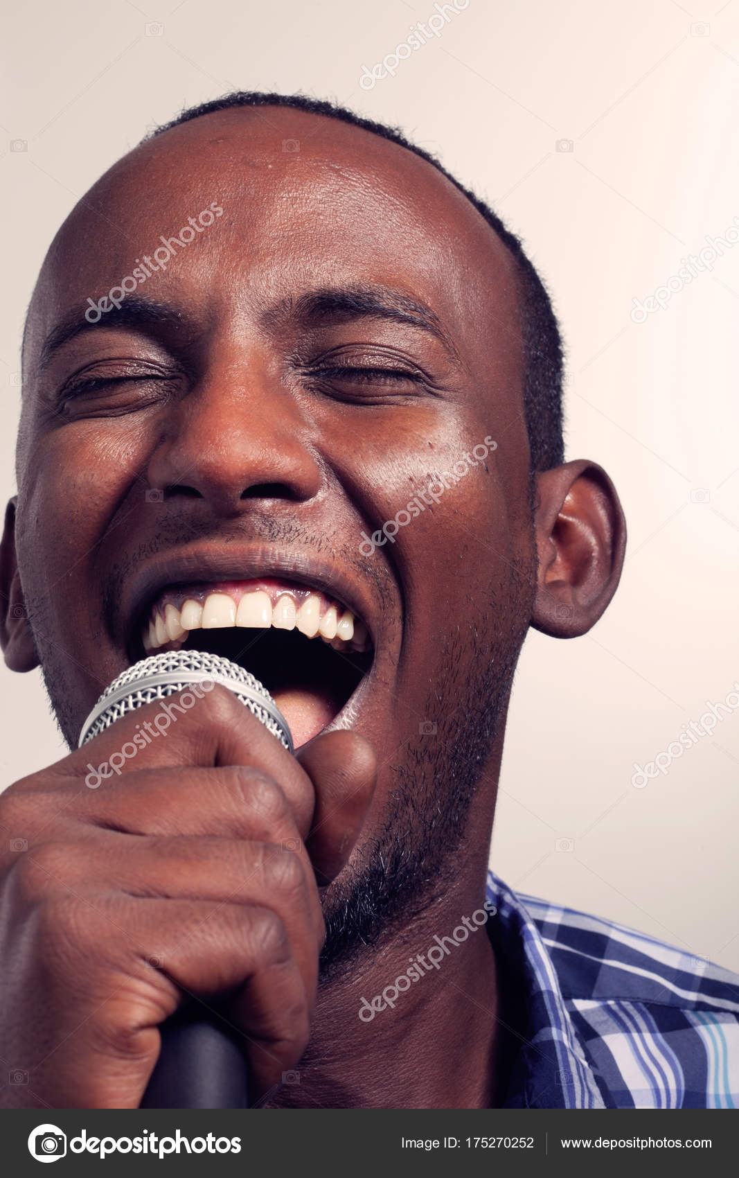 African singer with microphone — Stock Photo © Zveiger #175270252