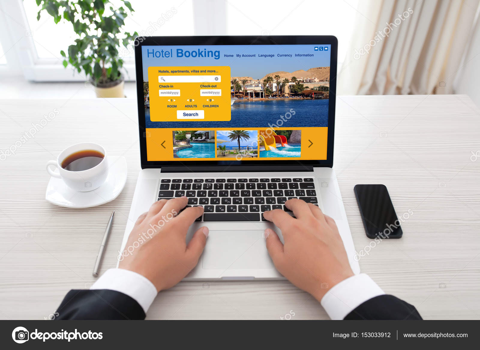 Man sitting behind laptop with hotel booking screen in office — Stock ...