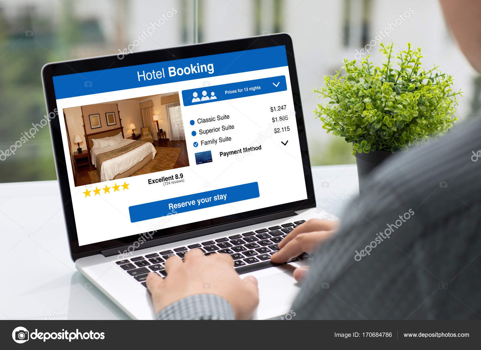 Man holding computer with app hotel booking screen in cafe — Stock ...