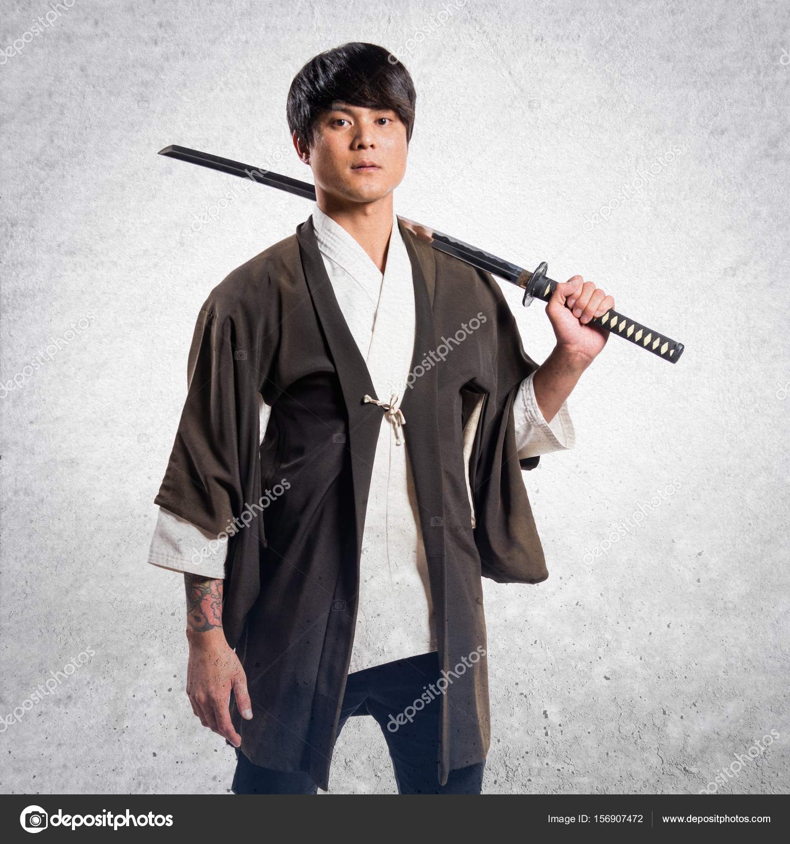 Asian samurai man with katana on textured background Stock Photo by ...